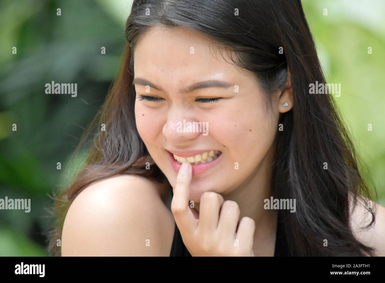 Thoughtful beautiful filipina female hi-res stock photography and ...