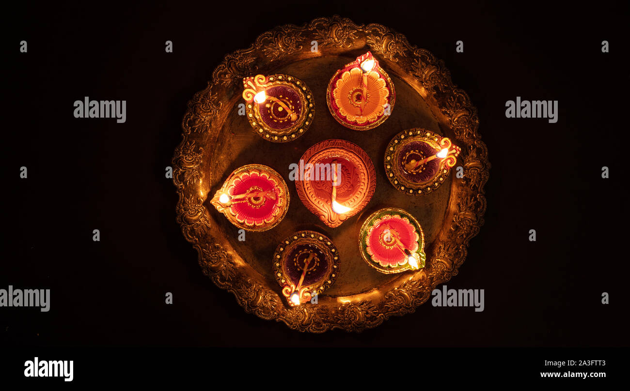 Happy Diwali. Clay diya candles illuminated in Dipavali, Hindu festival ...