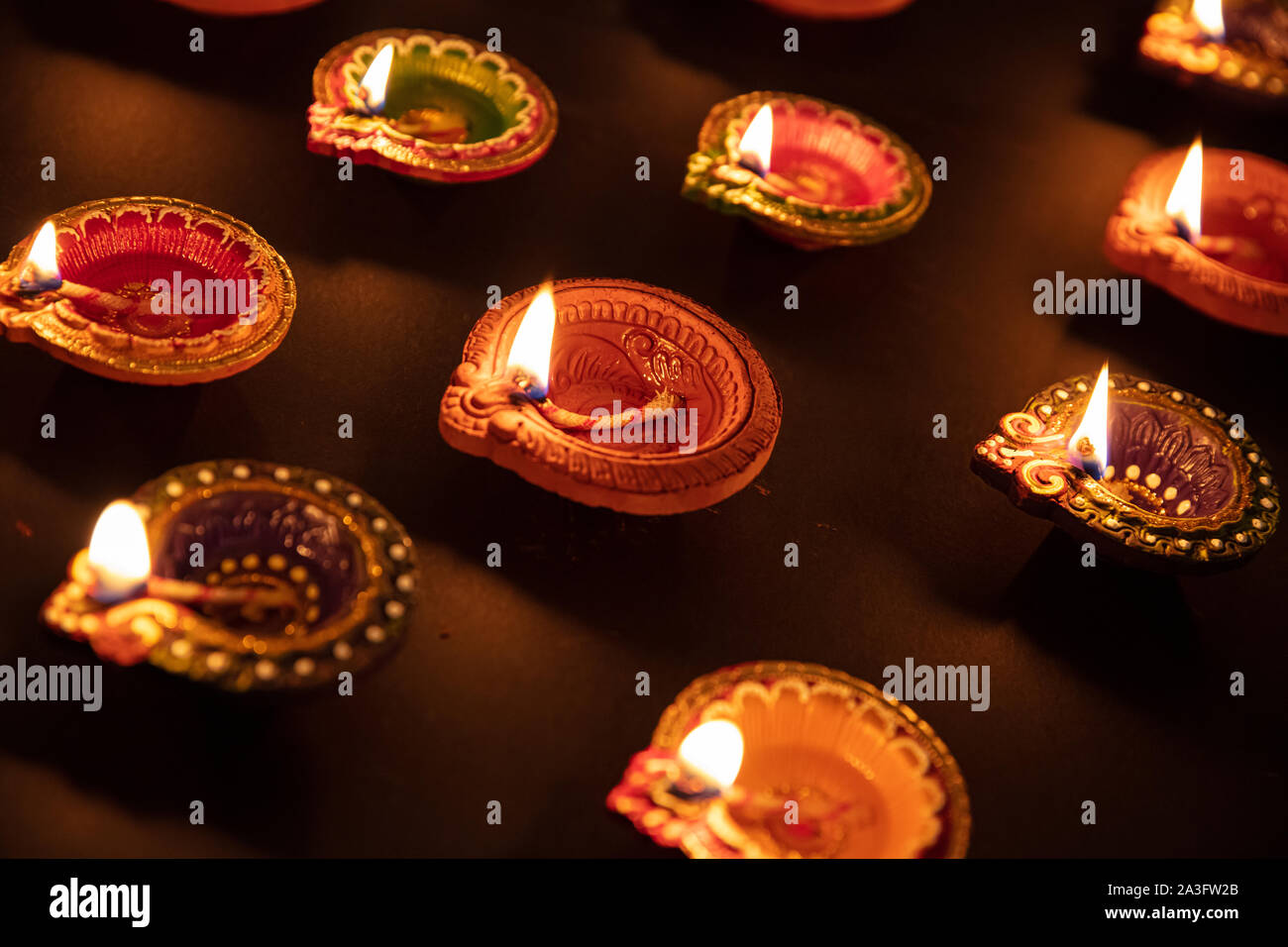 Happy Diwali. Clay diya candles illuminated in Dipavali, Hindu festival ...