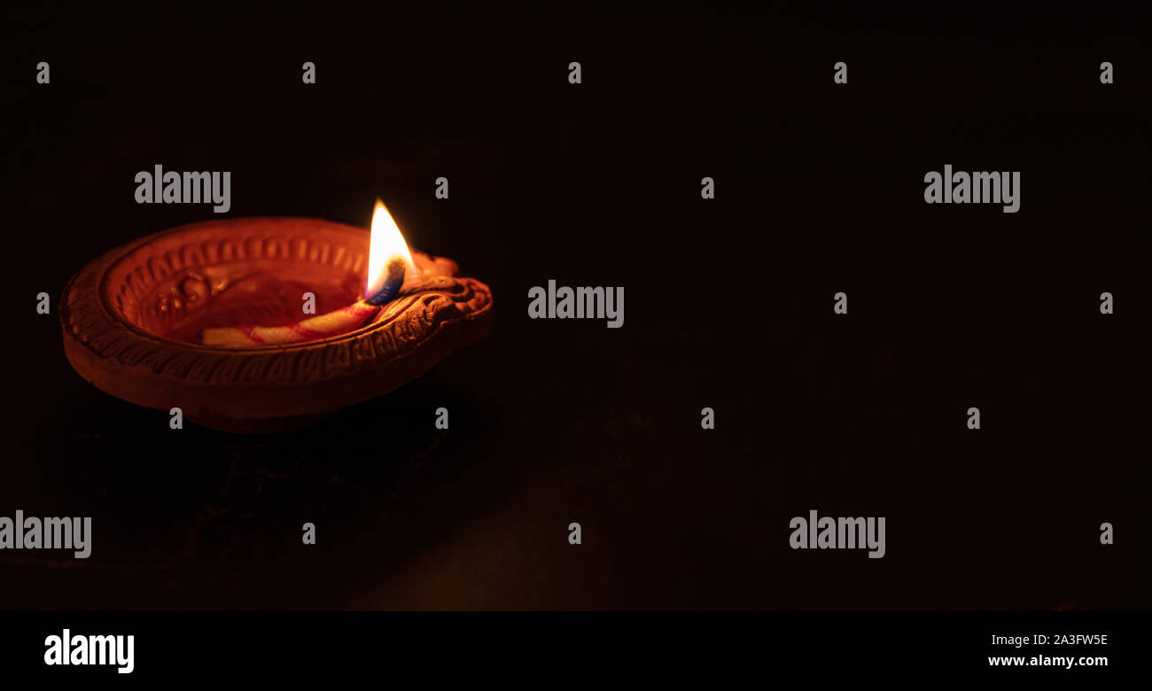 Diwali, Hindu festival of lights celebration. Clay diya candle ...