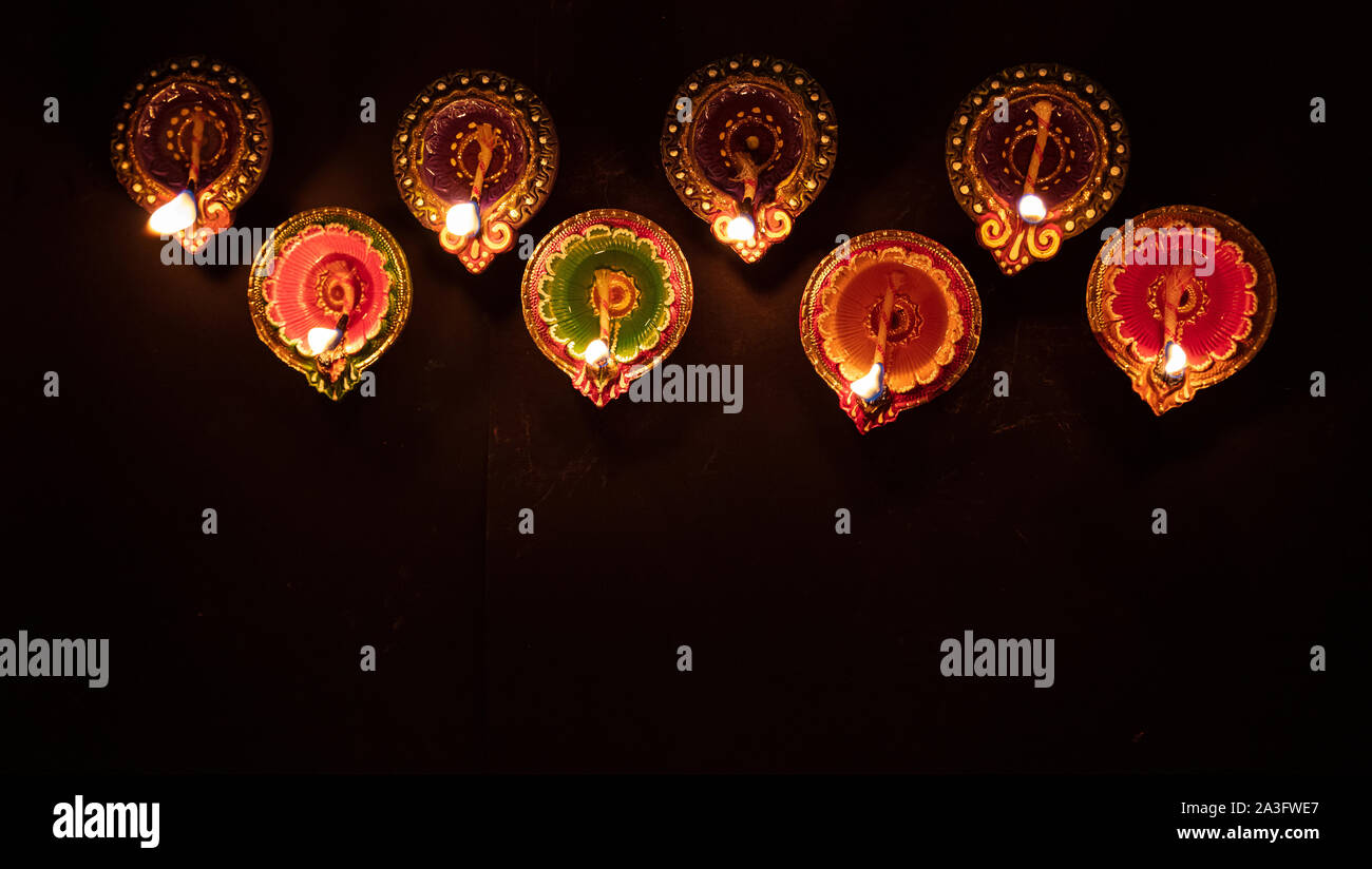 Happy Diwali. Clay diya candles illuminated in Dipavali, Hindu festival ...