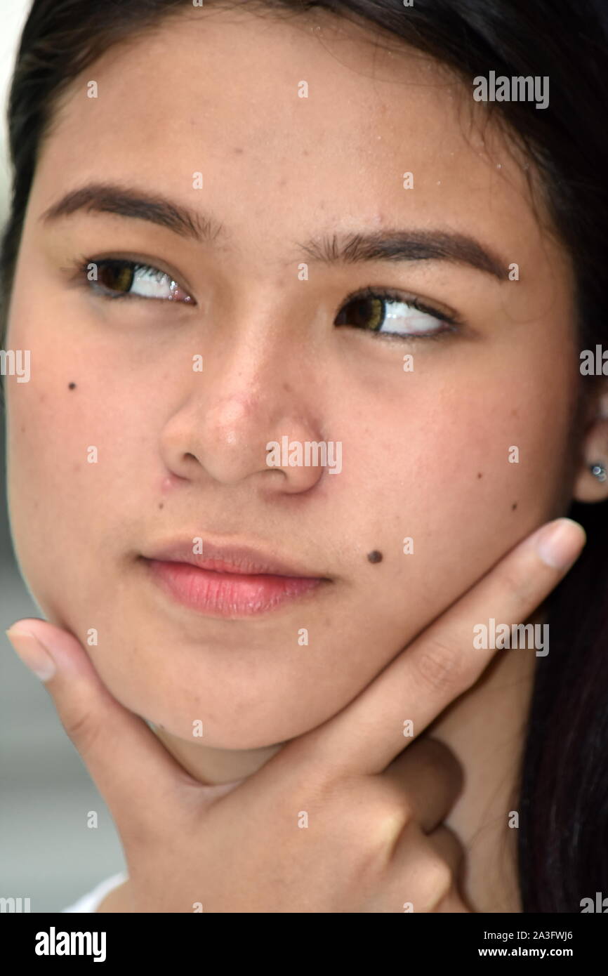 A Thoughtful Attractive Diverse Female Woman Stock Photo - Alamy