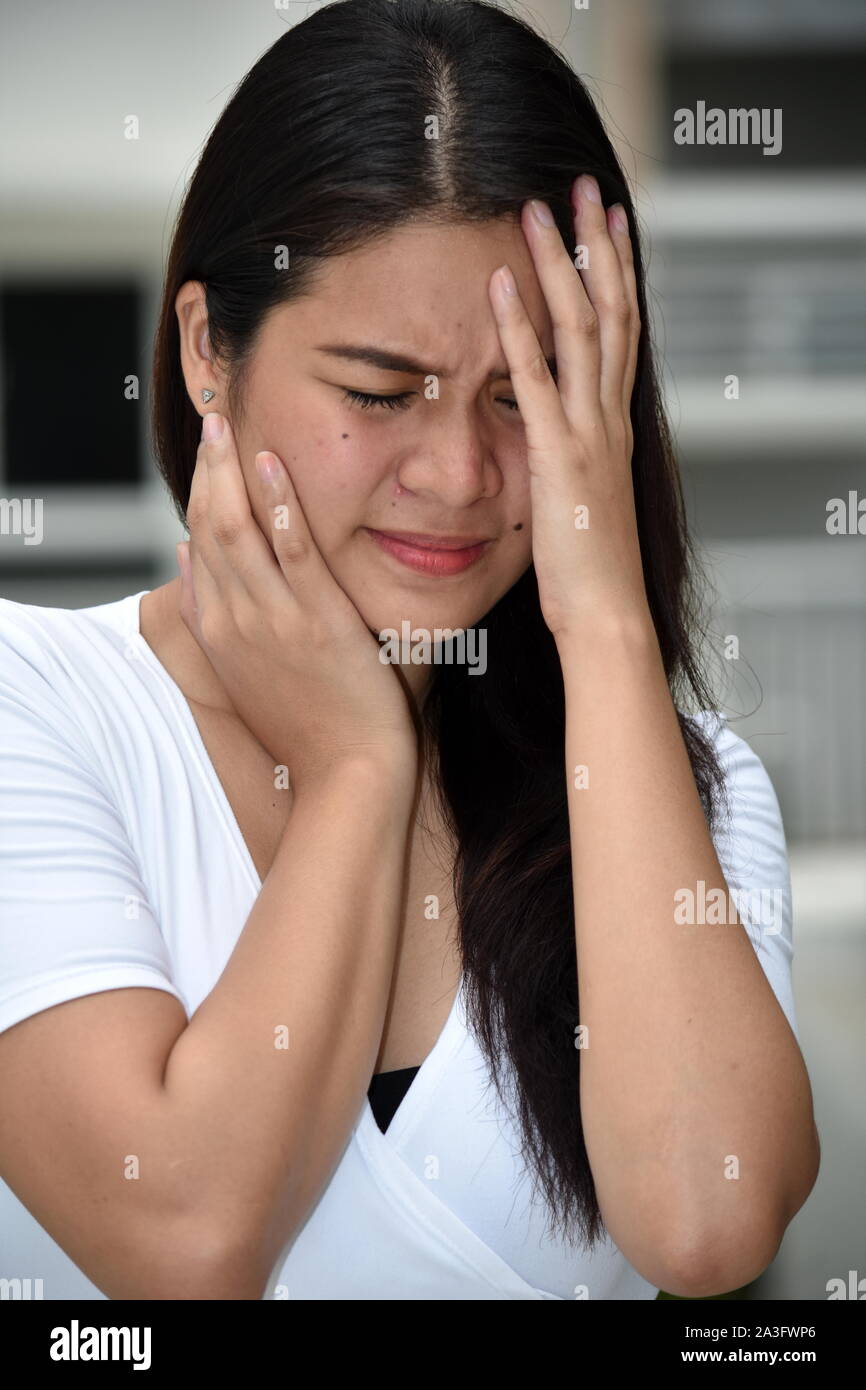 An Anxious Asian Person Stock Photo - Alamy