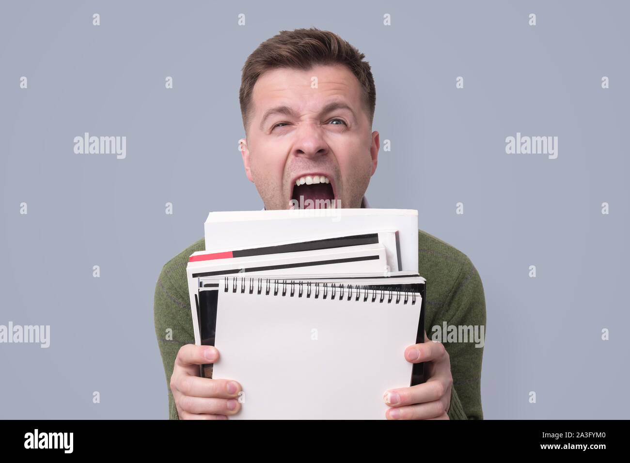 Irritated angry tired college student with a books tired to study Stock ...