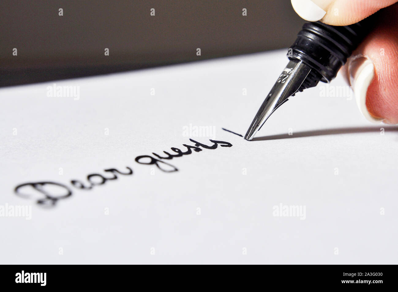 Woman hand writing letter by calligraphic pen Stock Photo - Alamy