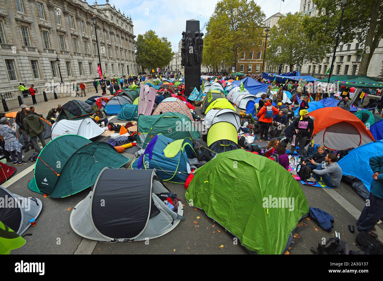 Extinction Rebellion (XR) protesters camp in tents around the Monument ...