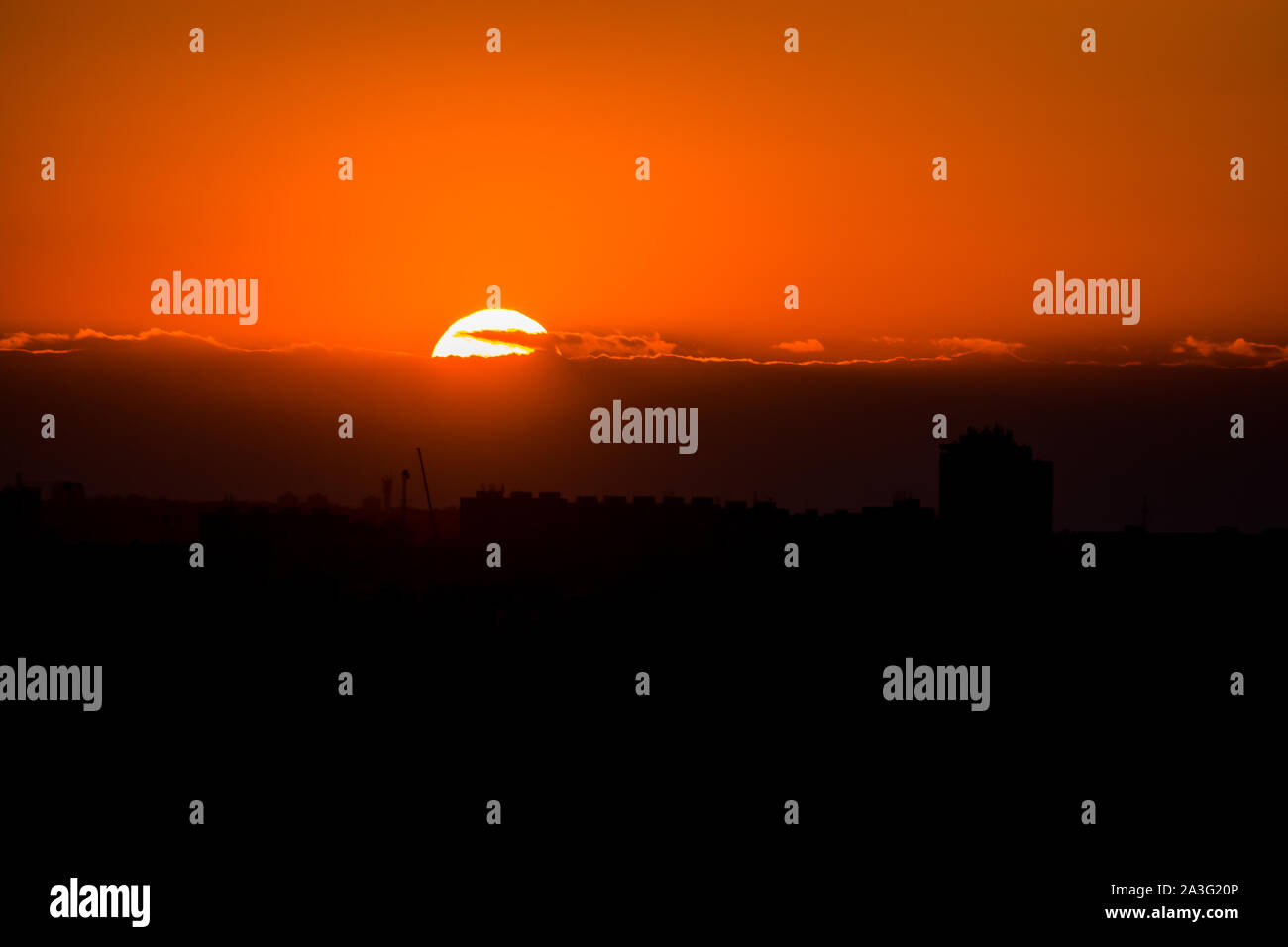 Orange sunset on horizon with big orange sun Stock Photo - Alamy