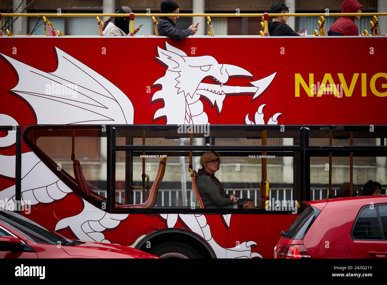 Cardiff Wales, open top tourist hop of hop on double decker bus with ...