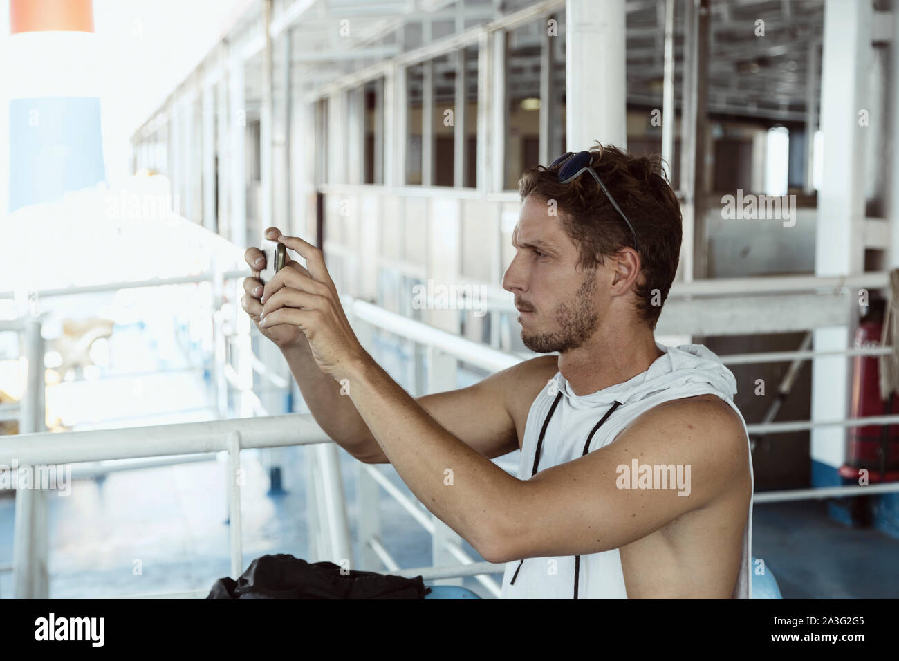 Young man on ferry boat hi-res stock photography and images - Alamy