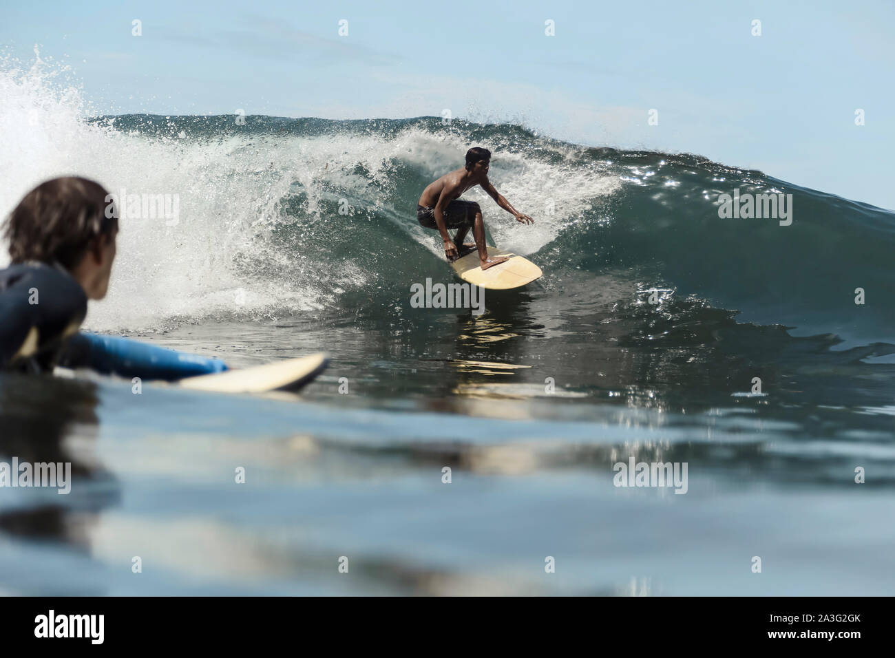 Surfer on a wave Stock Photo - Alamy