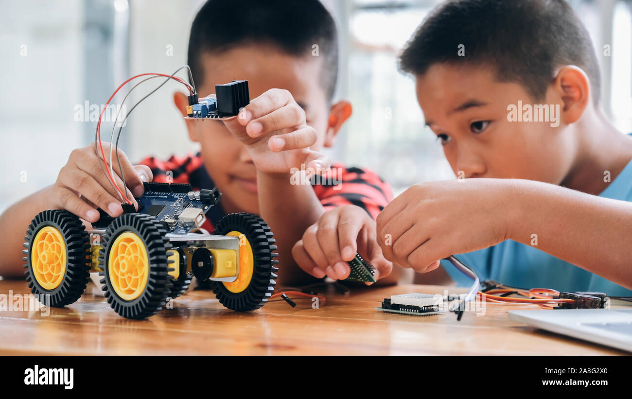 working on Handmade car model, construction on electronic. Concentrated ...