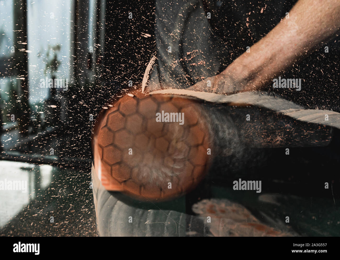 Professional glass polishing tool seen through glass, close-up on the ...