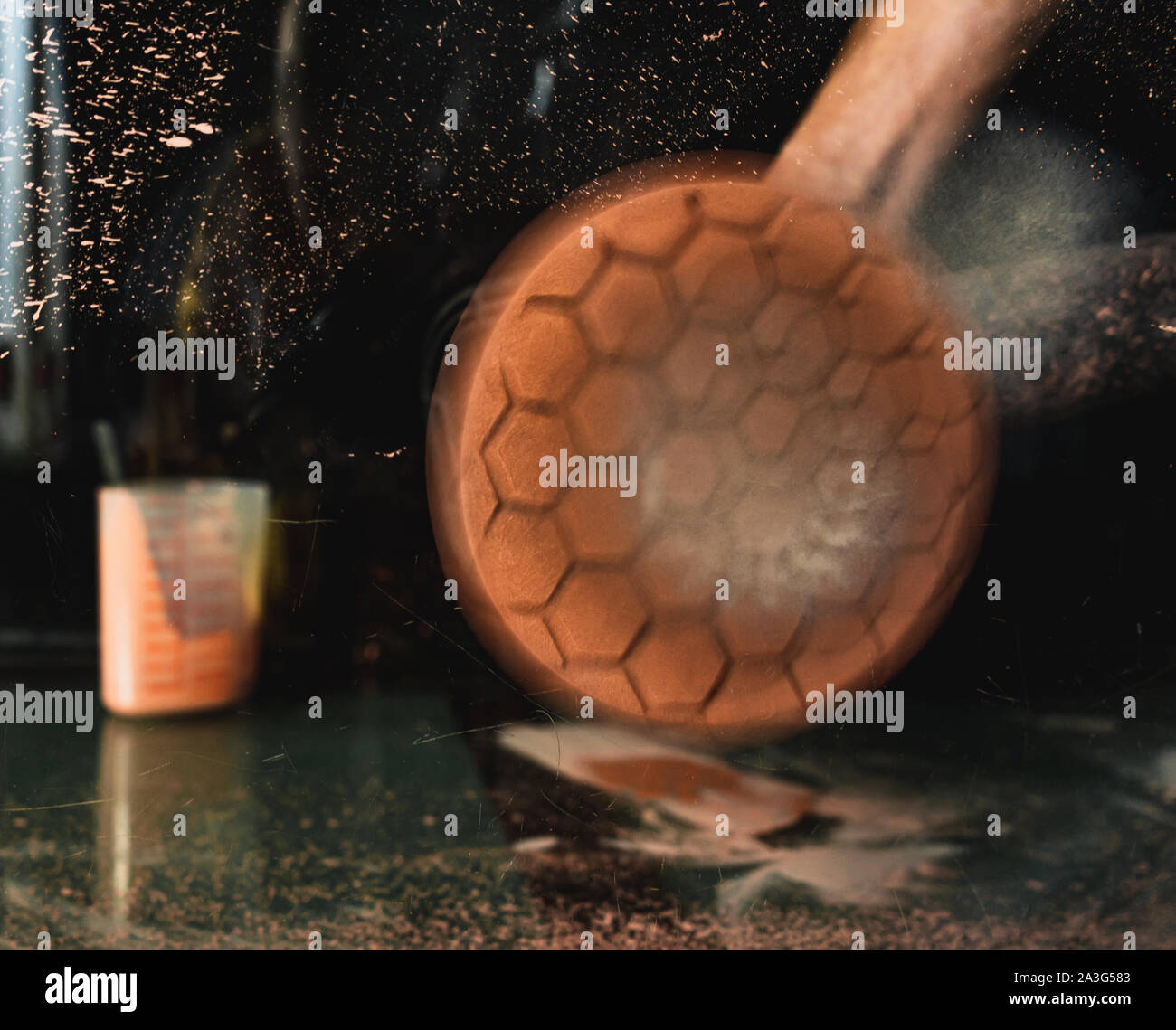 Mechanic using professional glass polishing tool to remove scratches ...