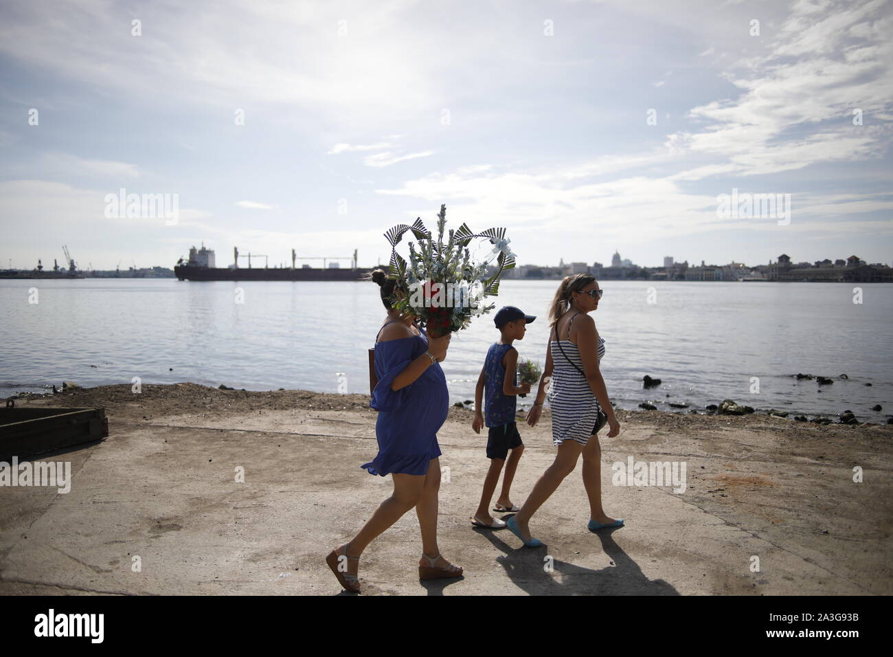 Cubans attend the procession to honor the Virgin of Regla, in Regla ...