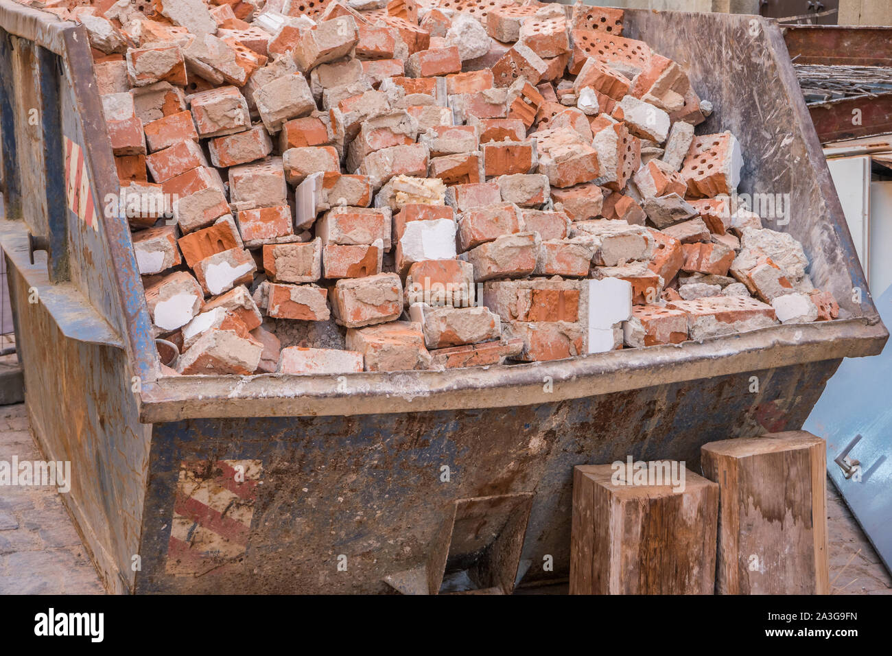 Bricks in a container of building rubble Stock Photo - Alamy