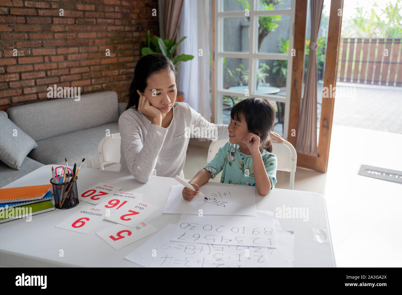 happy mum and kid learning maths together at home Stock Photo - Alamy