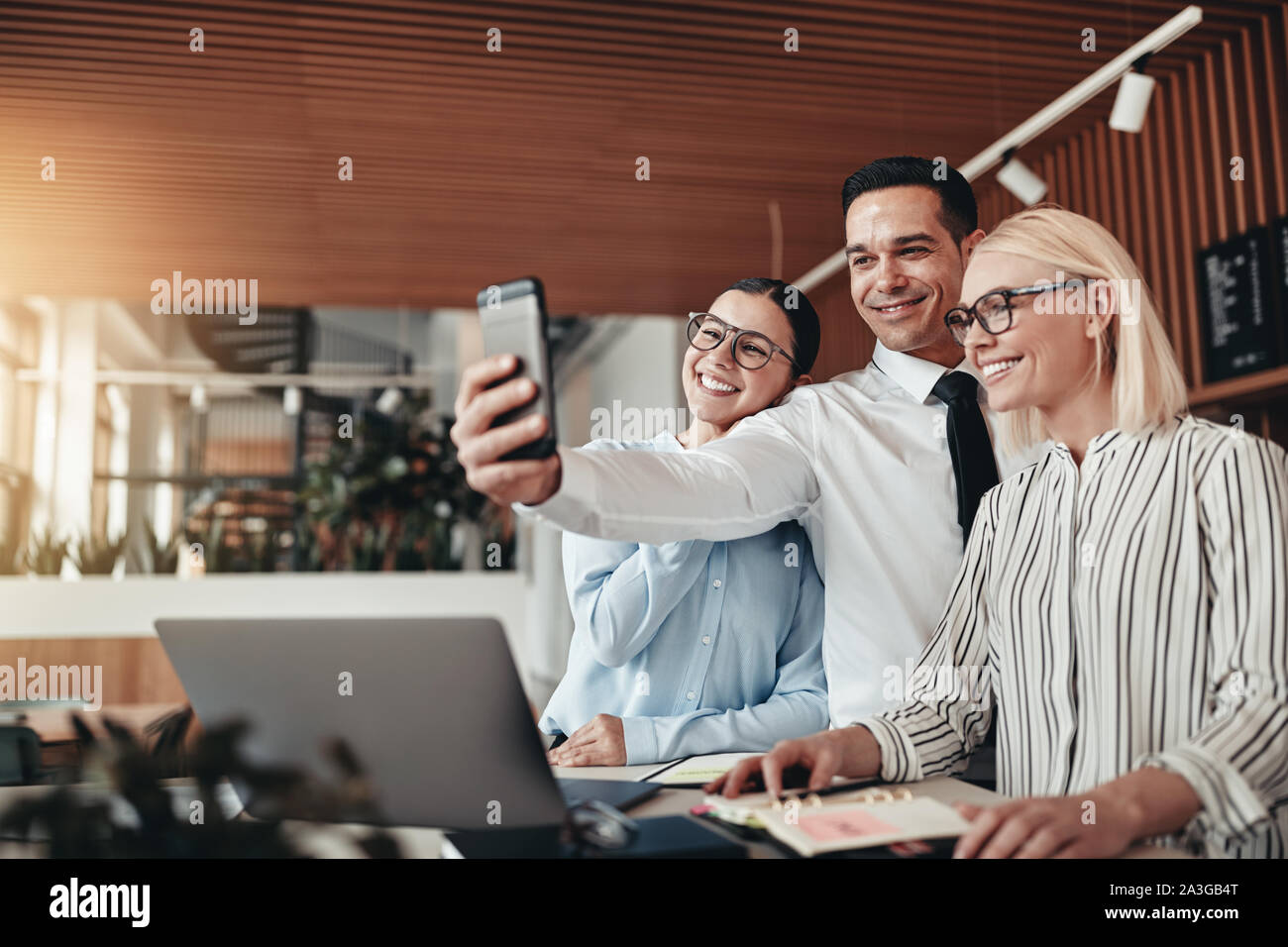 Businessman taking selfie colleagues in hi-res stock photography and ...