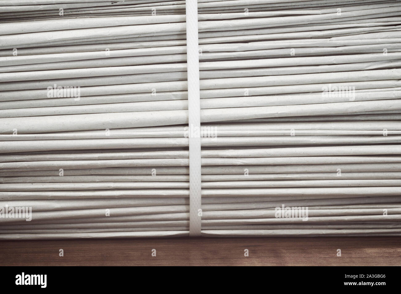 bundle of newspapers tied up Stock Photo - Alamy