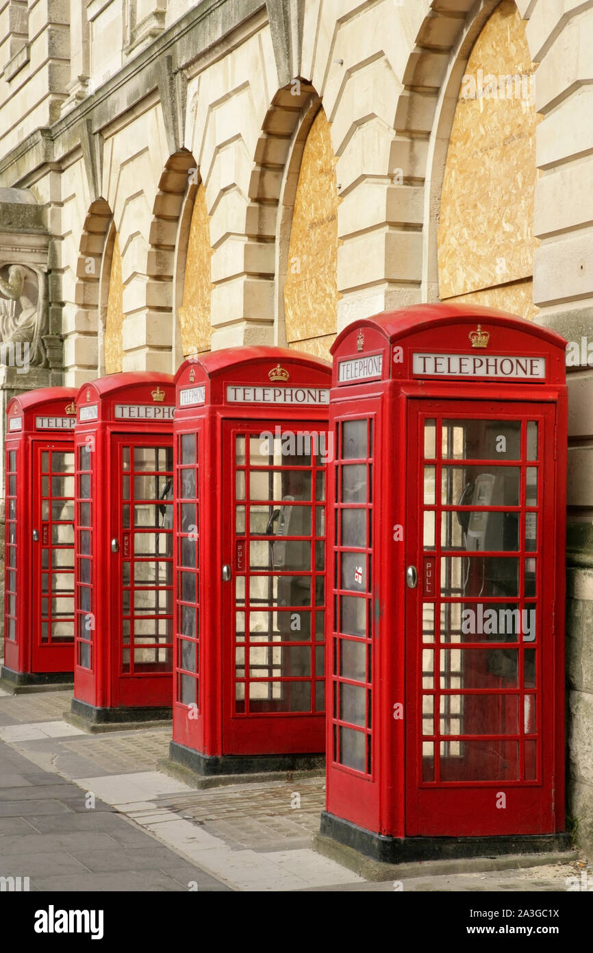 Row red telephone boxes hi-res stock photography and images - Alamy