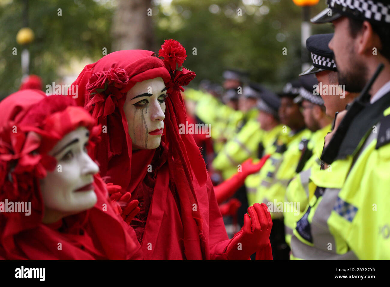 Protesters dubbed the Red Rebels at Millbank at the junction with Great ...