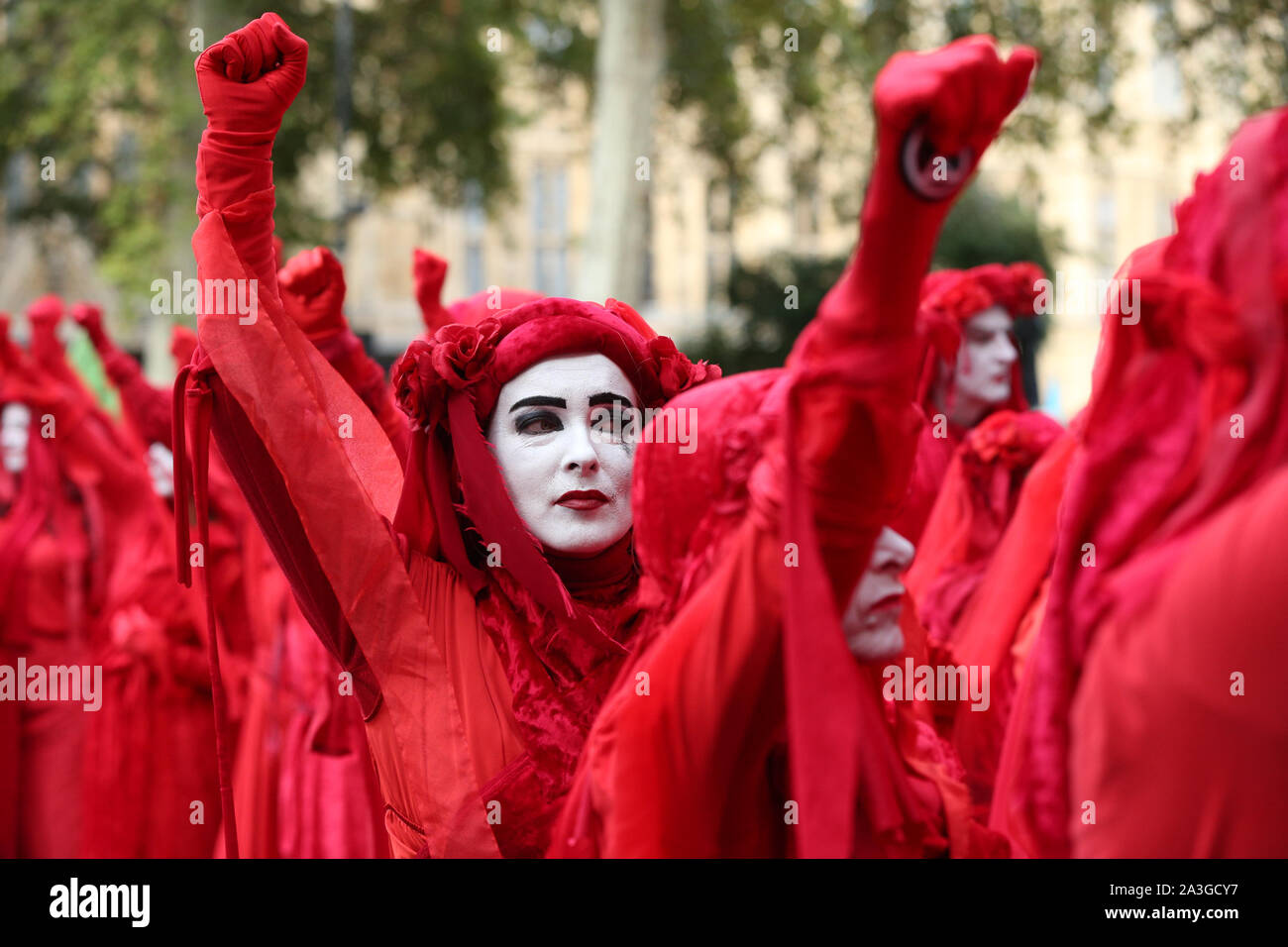 Protesters dubbed the Red Rebels at Millbank at the junction with Great ...