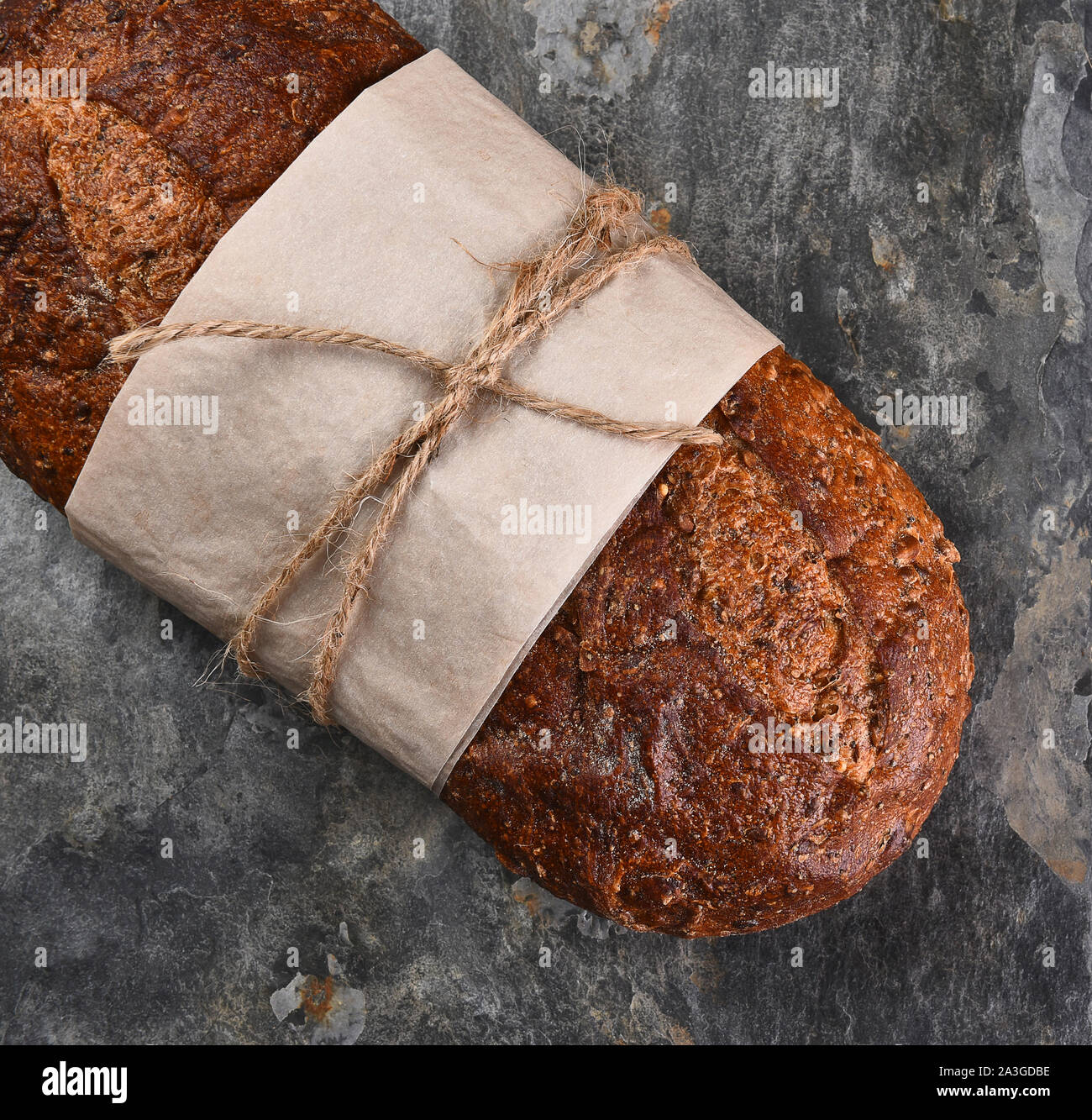 Flat Lay still life of a loaf of Multi-Grain Bread on Slate Background ...