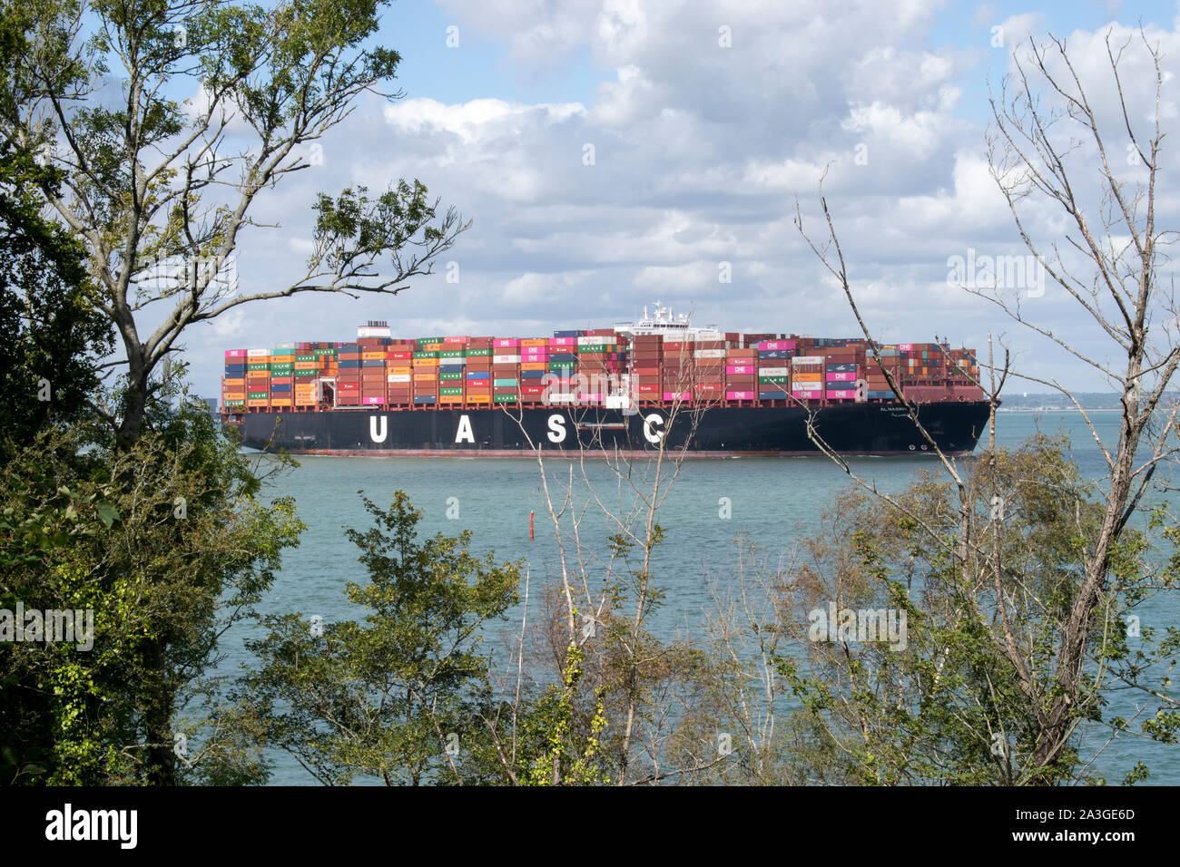 A fully laden container ship in The Solent pass the Isle of Wight Stock ...