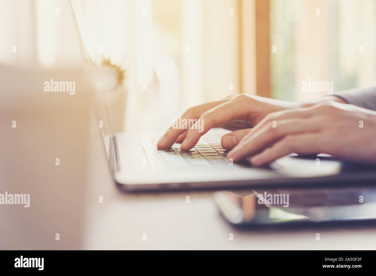Business woman hand typing laptop computer on wooden table Stock Photo ...