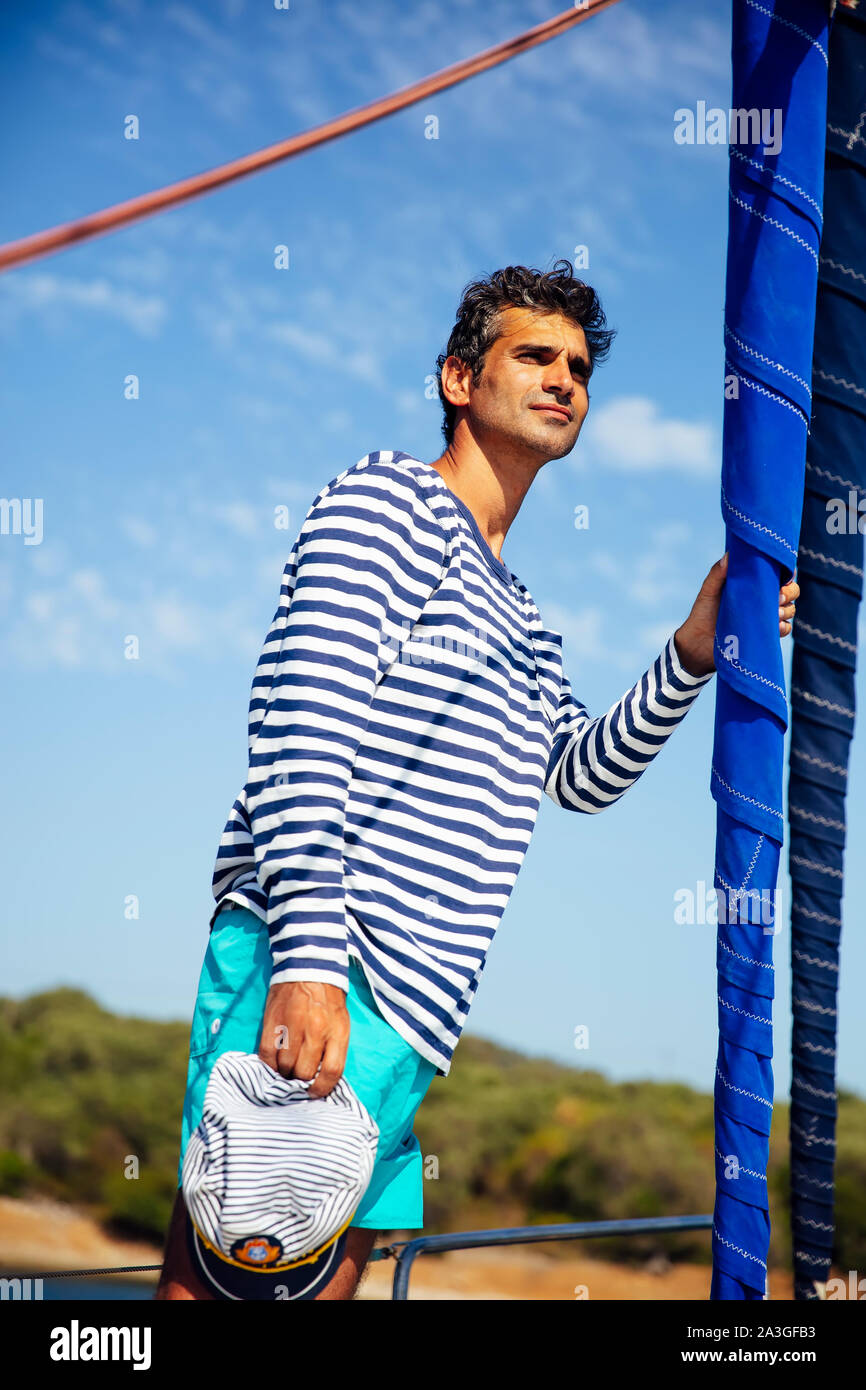 Portrait with cap he is captain of the sailboat hi-res stock ...
