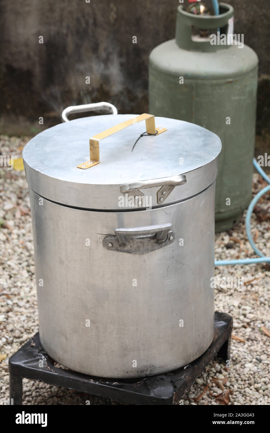 big cauldron and the gas cylinder at camp site Stock Photo - Alamy