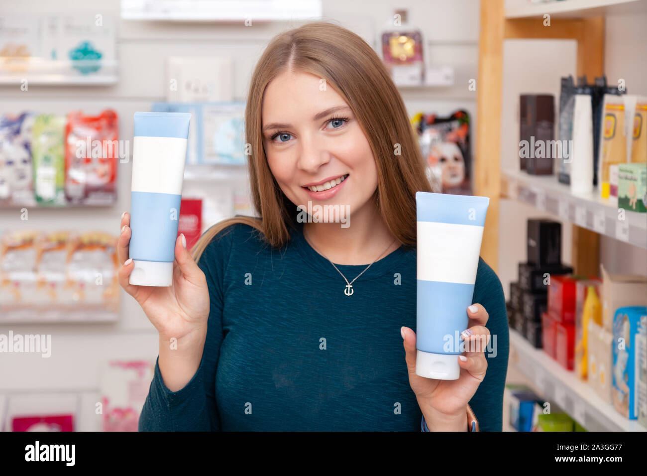 Beautiful caucasian girl cosmetologist hold box, tubes with cosmetic ...