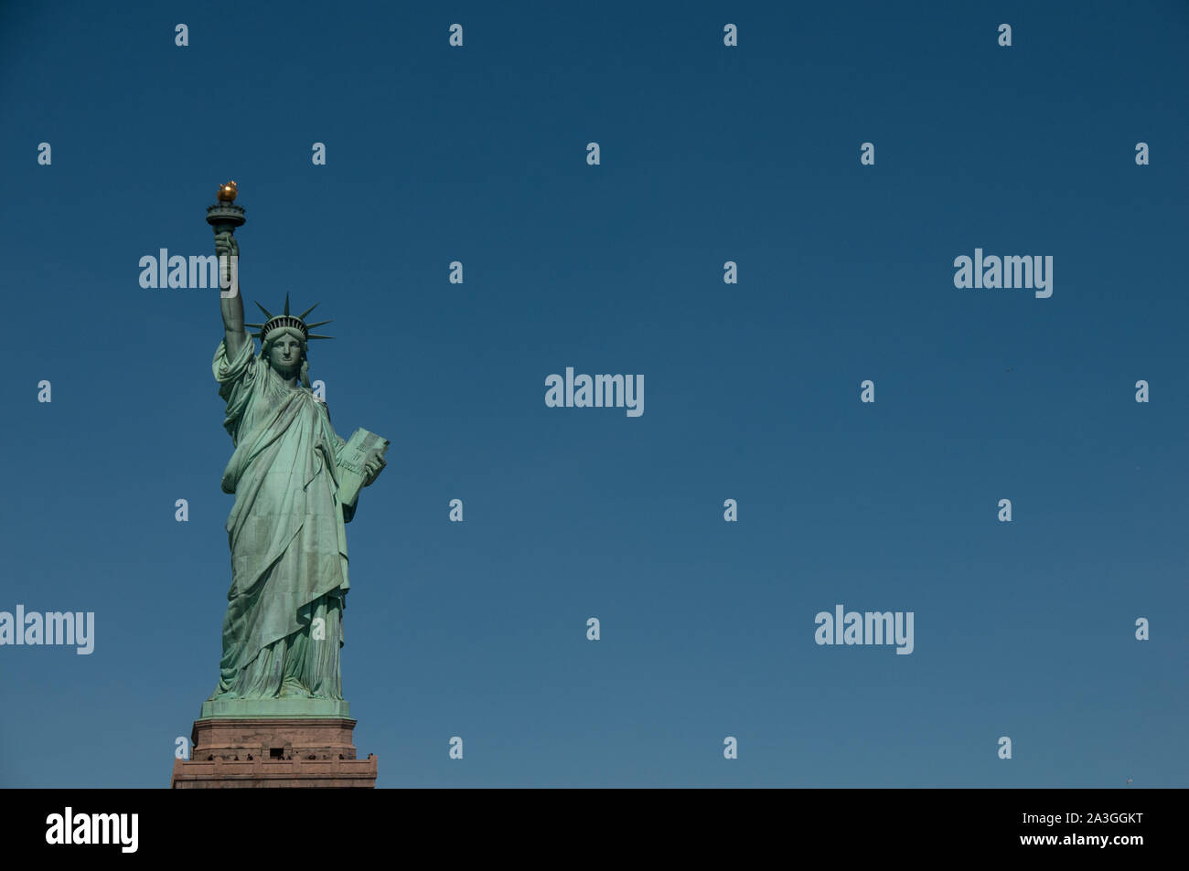 Statue of Liberty in New York to left of image with negative space ...