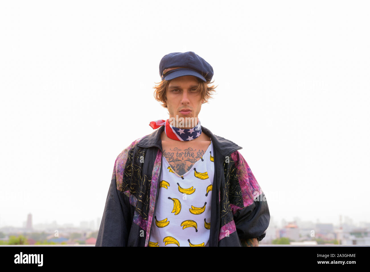 Young handsome rebellious man outdoors wearing hat Stock Photo - Alamy