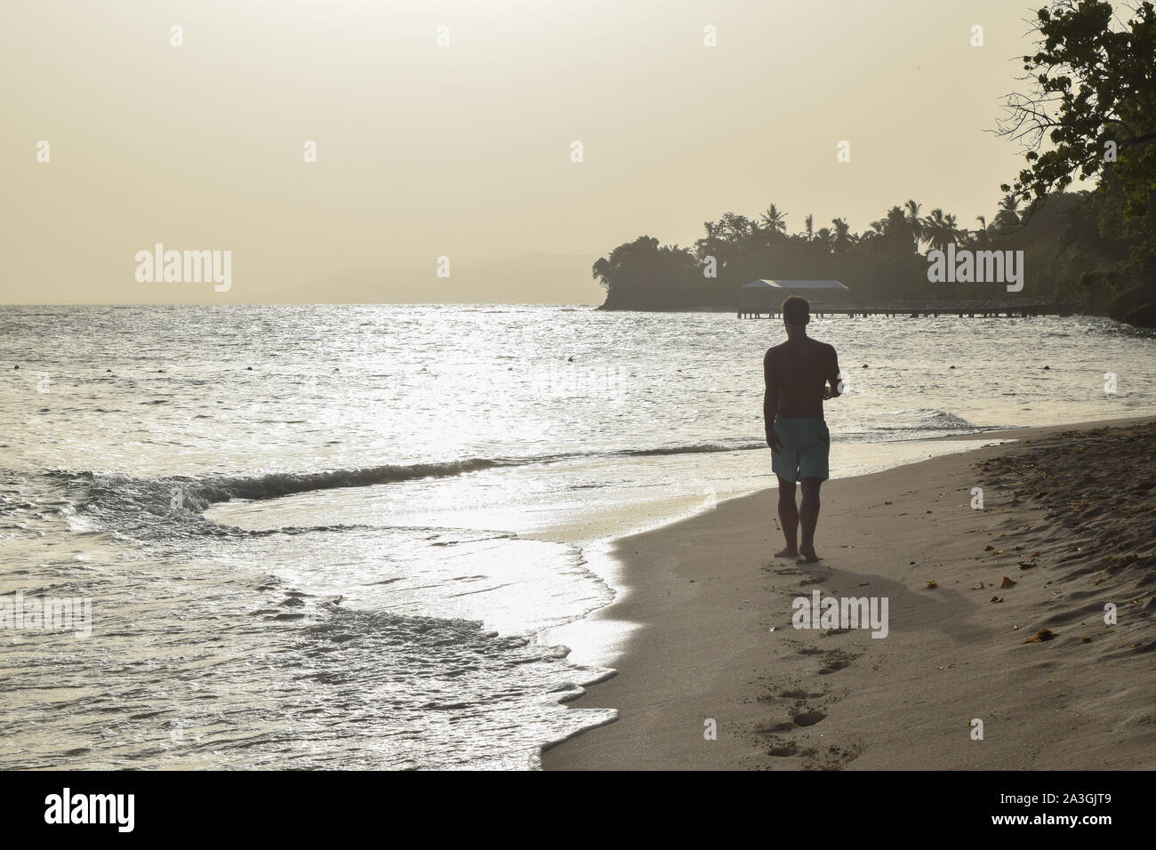 Beach walk into the sunset Stock Photo - Alamy