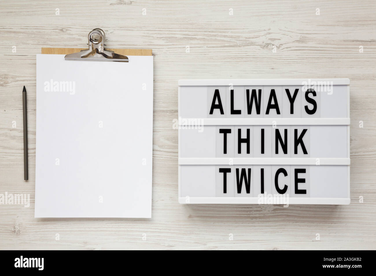 'Always think twice' words on a modern board, clipboard with blank ...