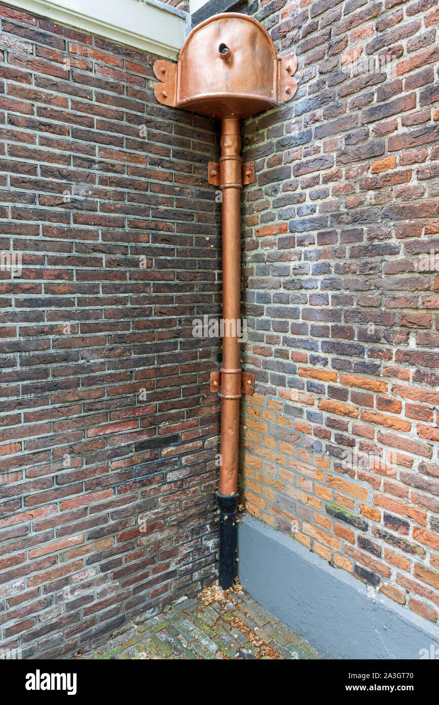 Copper Metal Gutter Pipe in House Corner Stock Photo - Alamy
