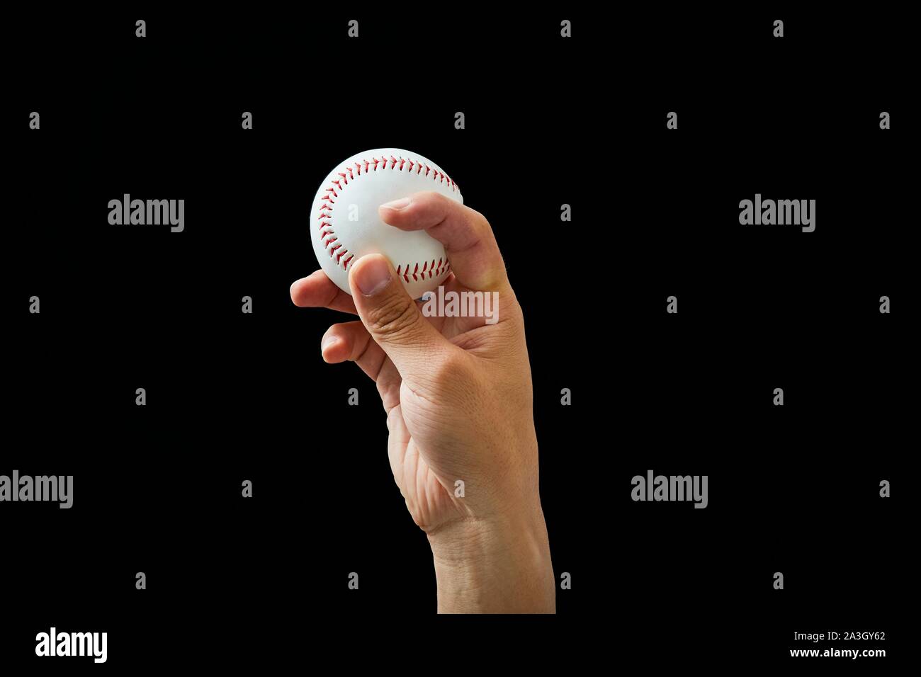 Male hand holding baseball ball Stock Photo - Alamy