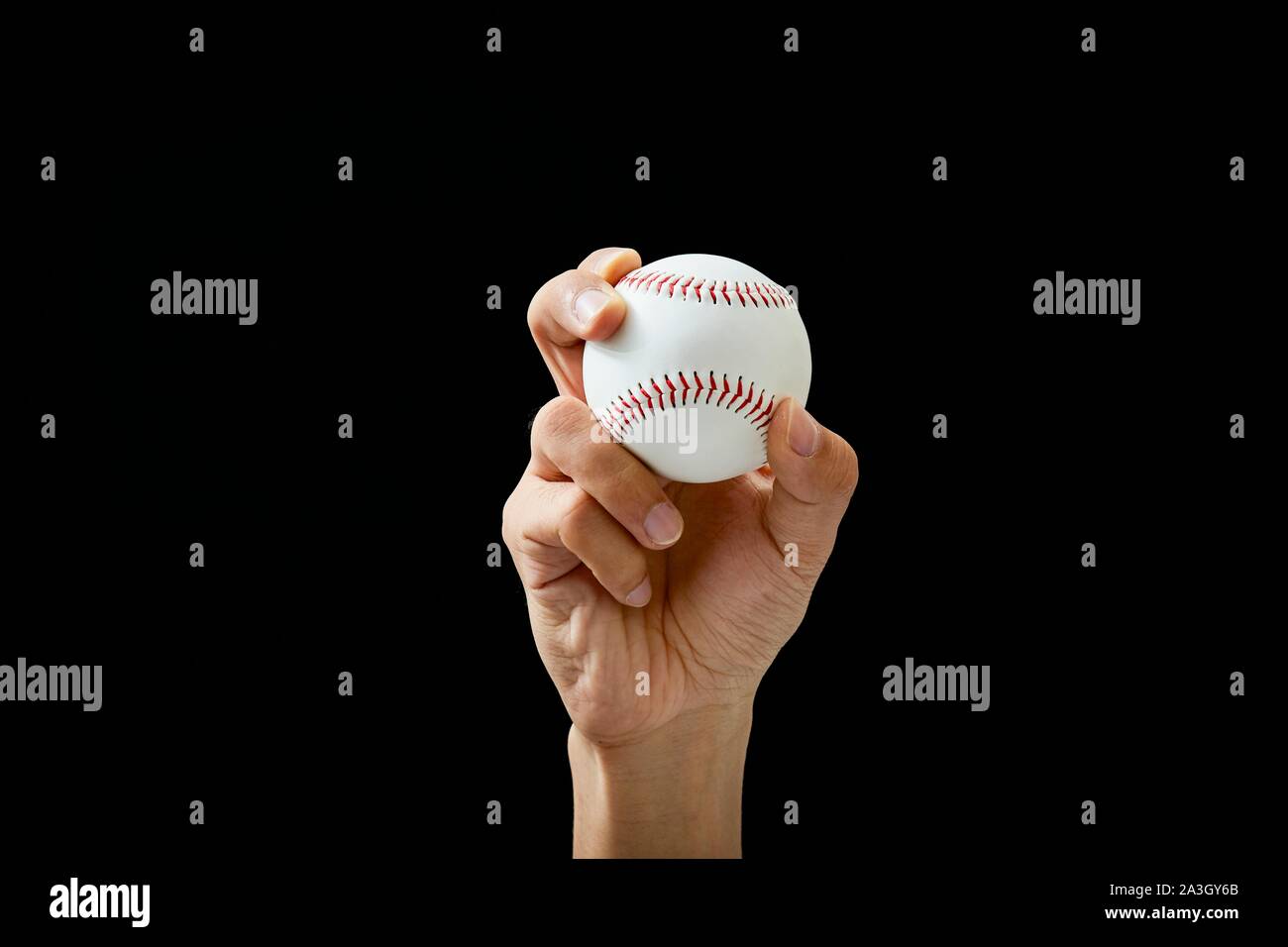 Male hand holding baseball ball Stock Photo - Alamy