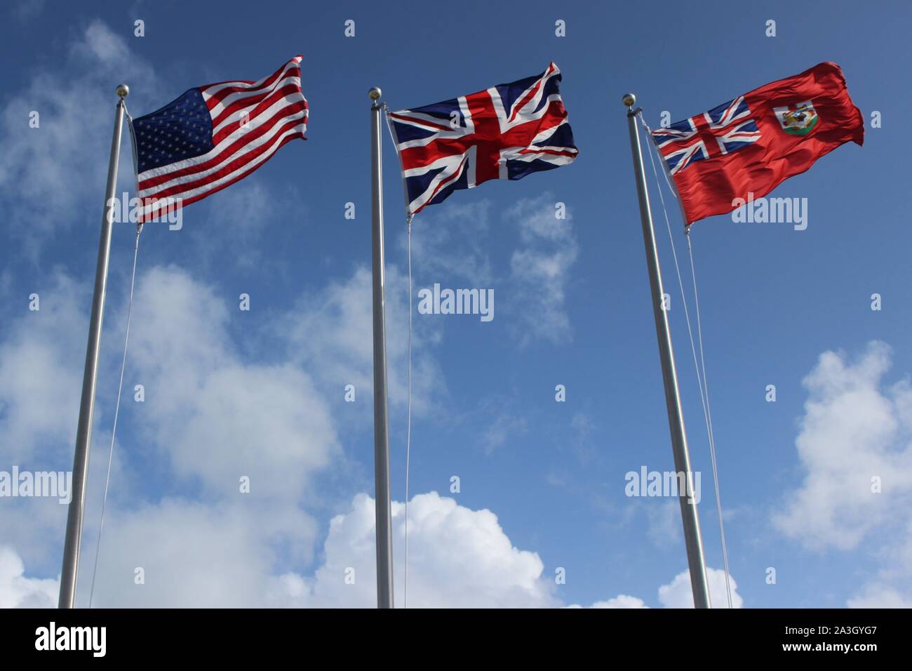 US, British and Bermudian flags flying over Royal Naval Dockyard ...