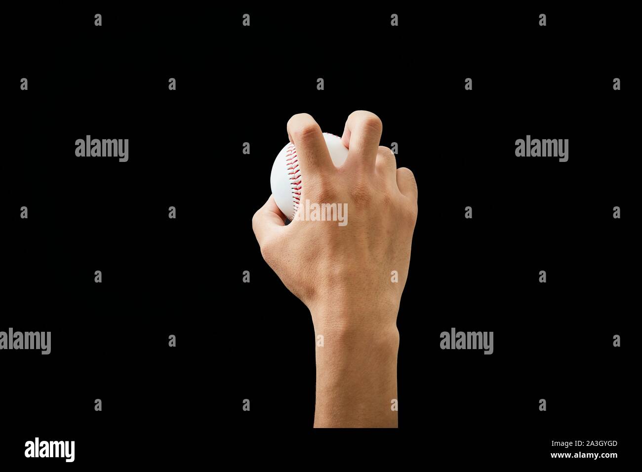 Male hand holding baseball ball Stock Photo - Alamy