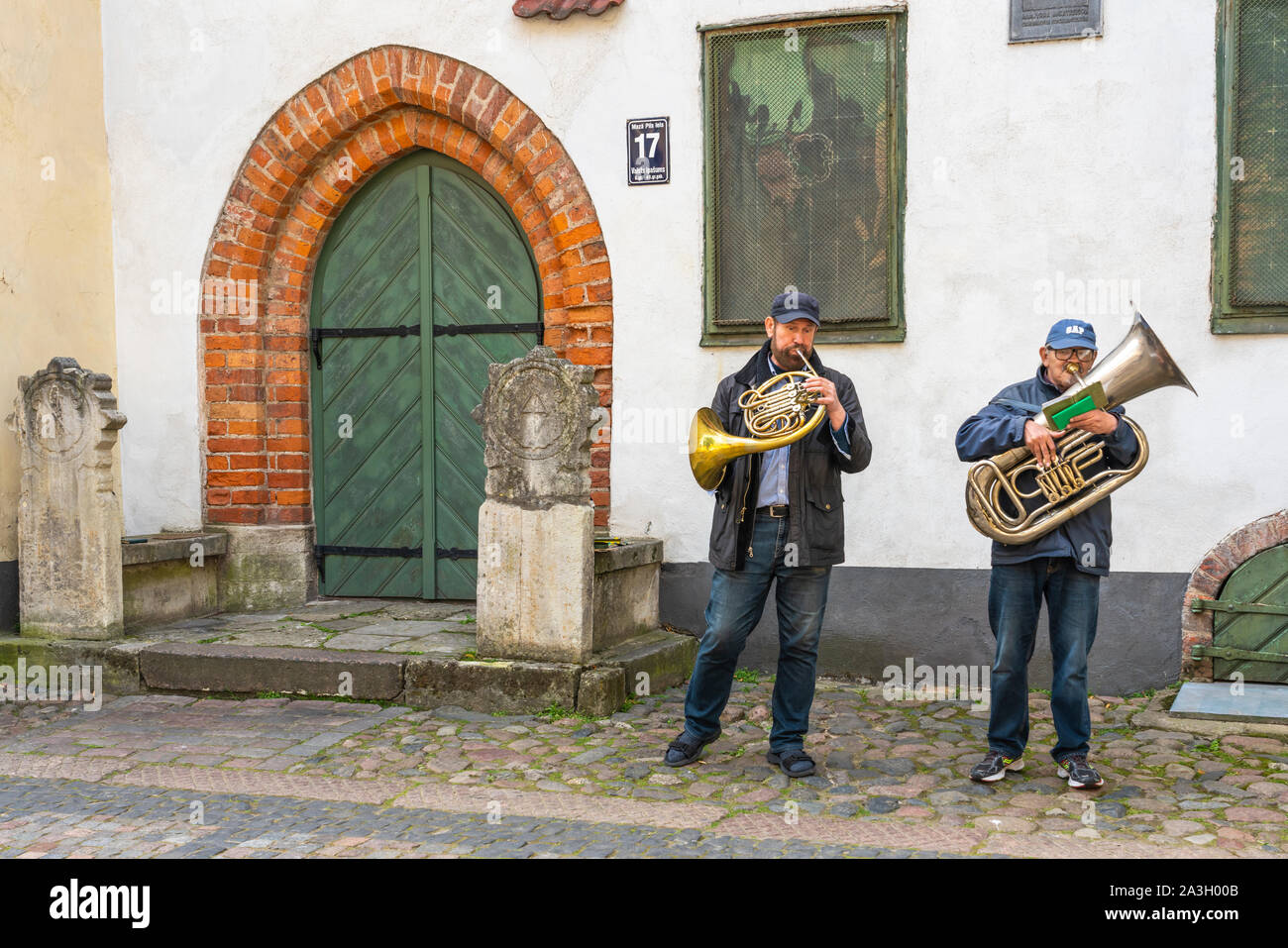 Two men playing brass instruments on the street in Riga, Latvia Stock ...