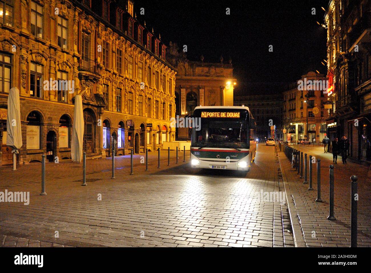 France, Nord, Lille, Grand Place, Ilevia network bus running at night ...