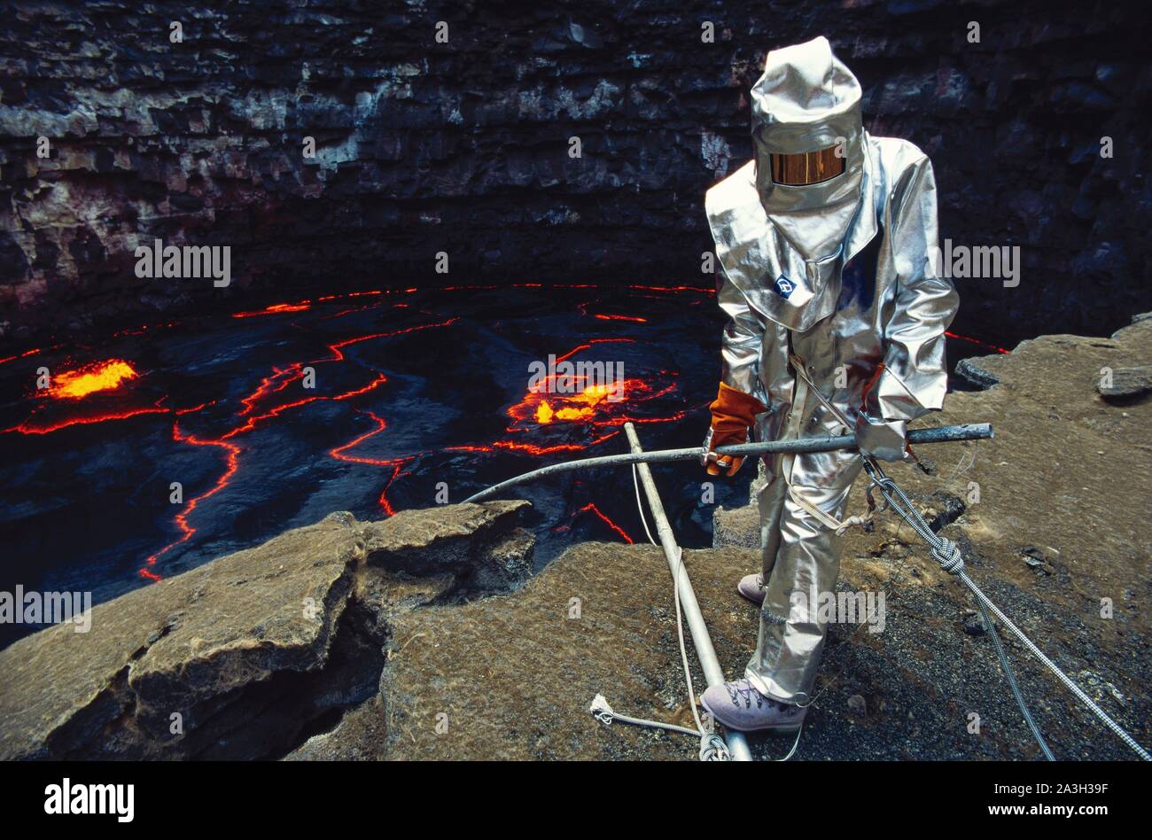 Ethiopia, Danakil Desert, Volcanologists conduct lava sampling in Erta ...