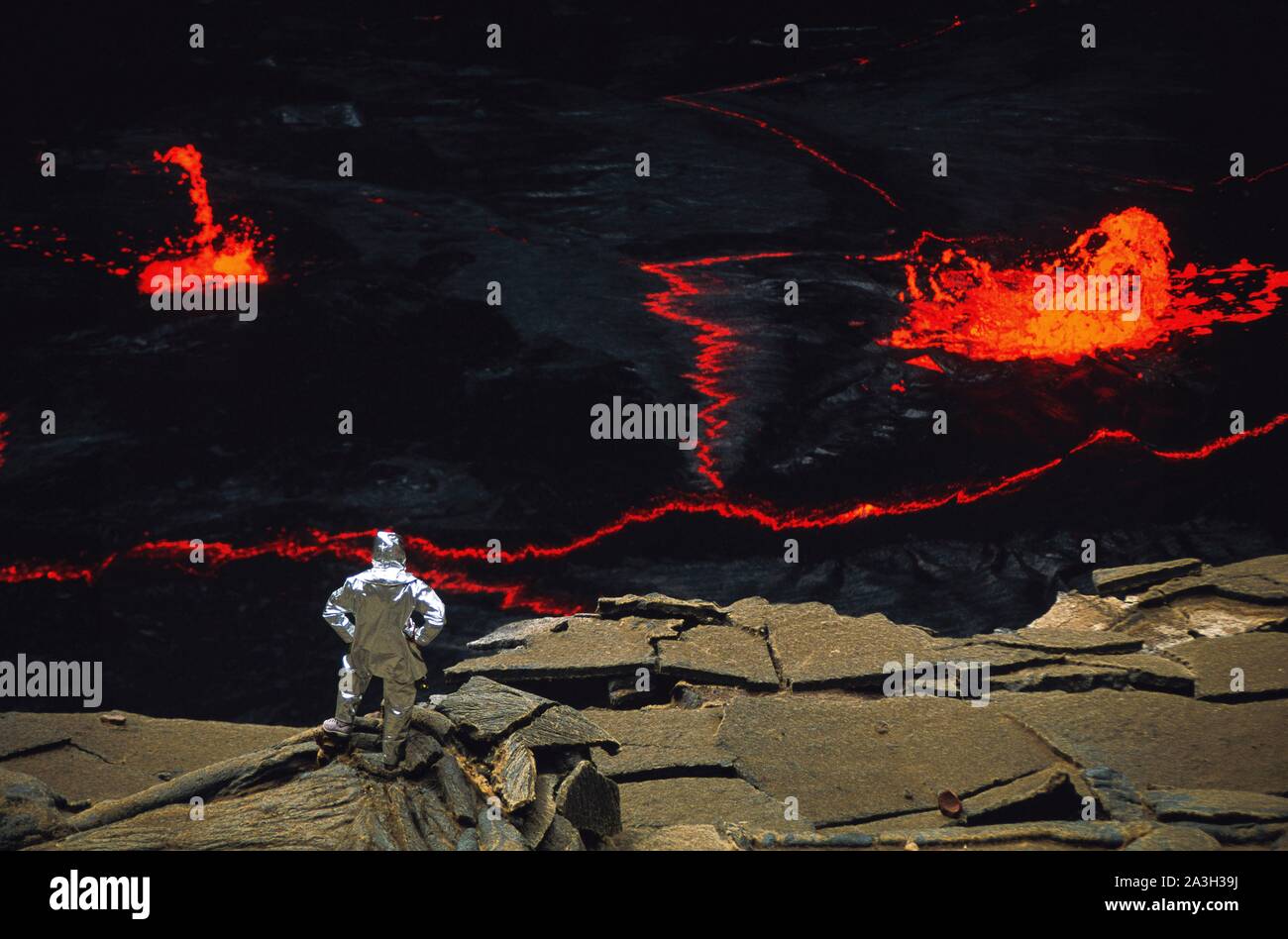 Ethiopia, Danakil Desert, Volcanologists conduct lava sampling in Erta ...