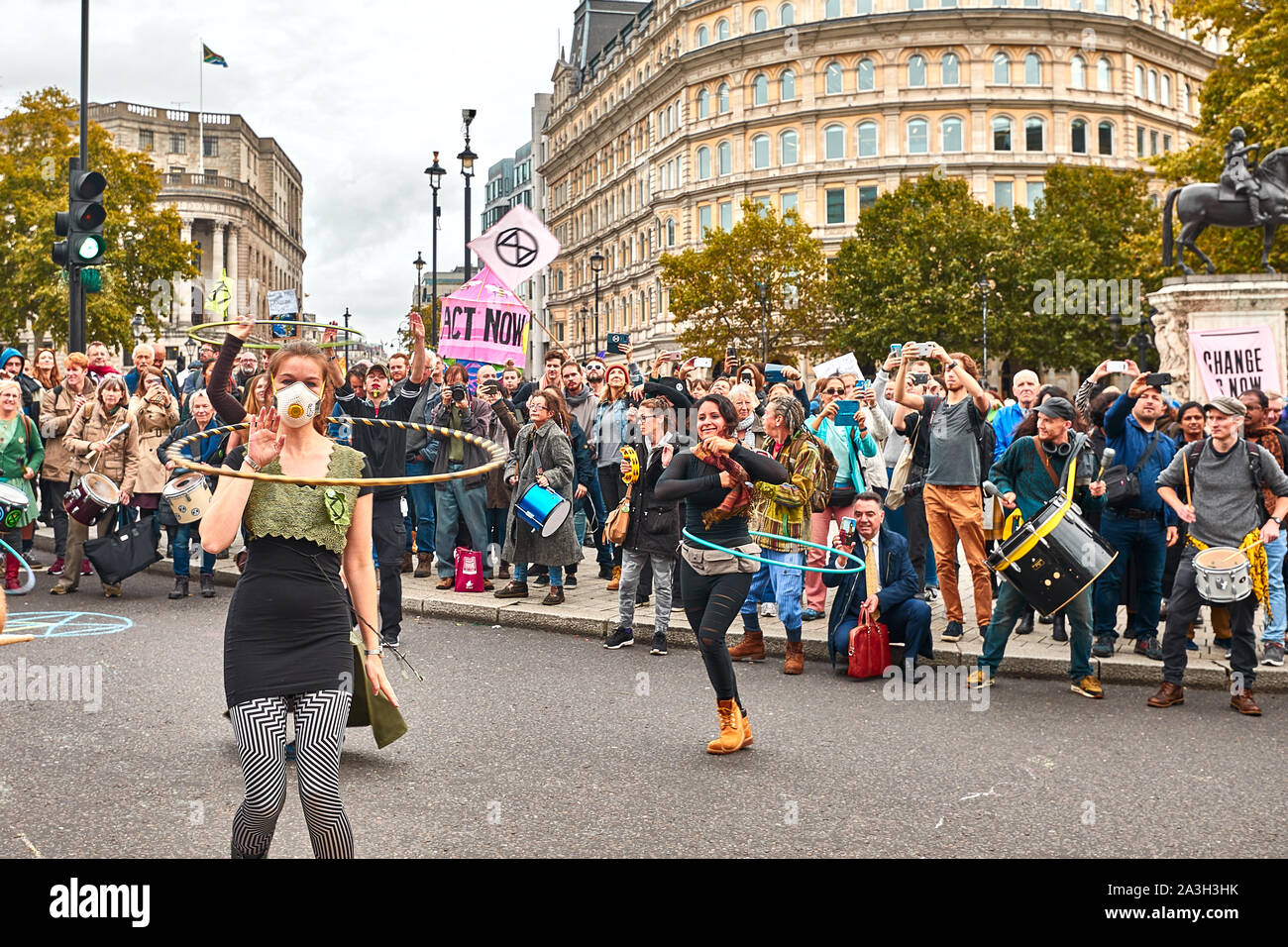 London, U.K. - Oct 8, 2019: Hula-hoop dancers make an impromptu display ...