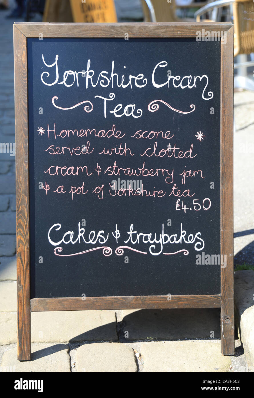 Sign for Yorkshire Cream Tea, in cafe on Main Street, in the village of ...