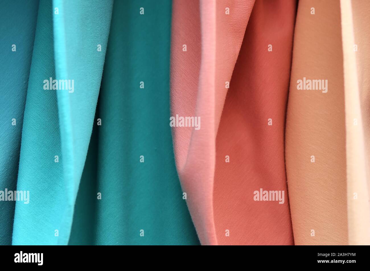 Colorful detailed fabric textures of different cloth types in a close ...