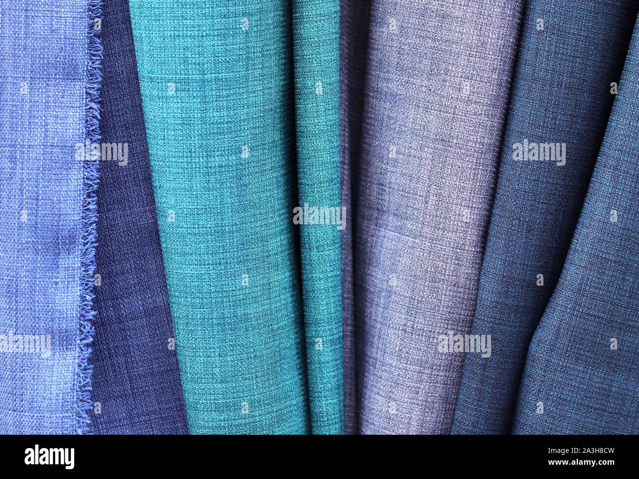 Colorful detailed fabric textures of different cloth types in a close ...