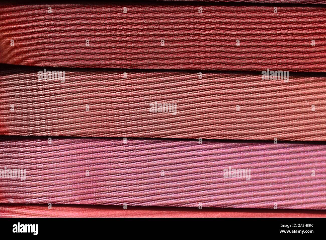 Colorful detailed fabric textures of different cloth types in a close ...