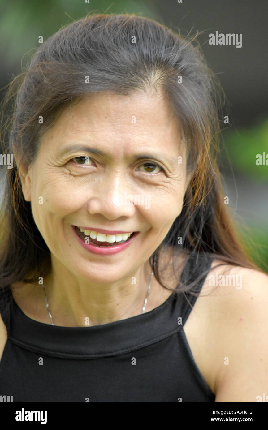 A Filipina Female Senior Smiling Stock Photo - Alamy